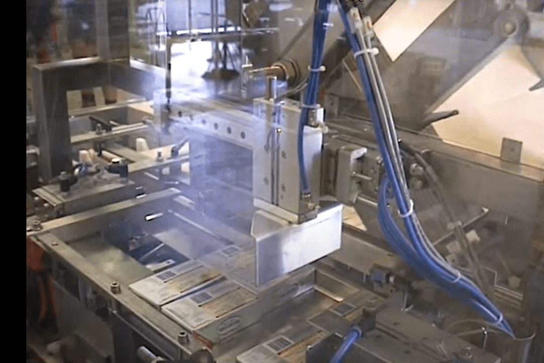 Wraparound Case Packer packing packets of cream cheese - Propac